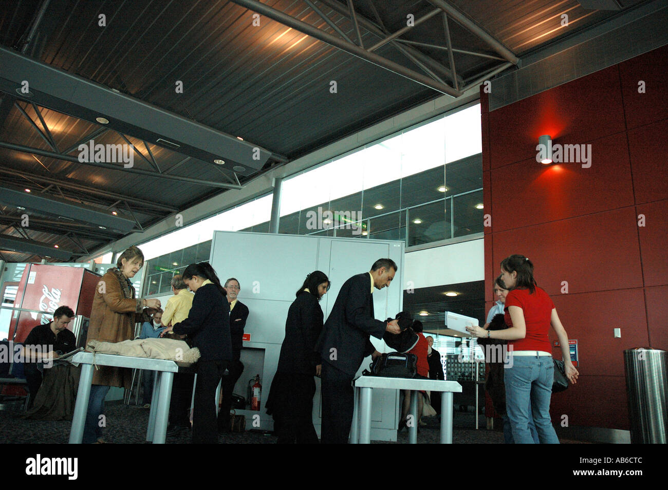 Security guards inspecting luggage of passengers as the arrive at ...