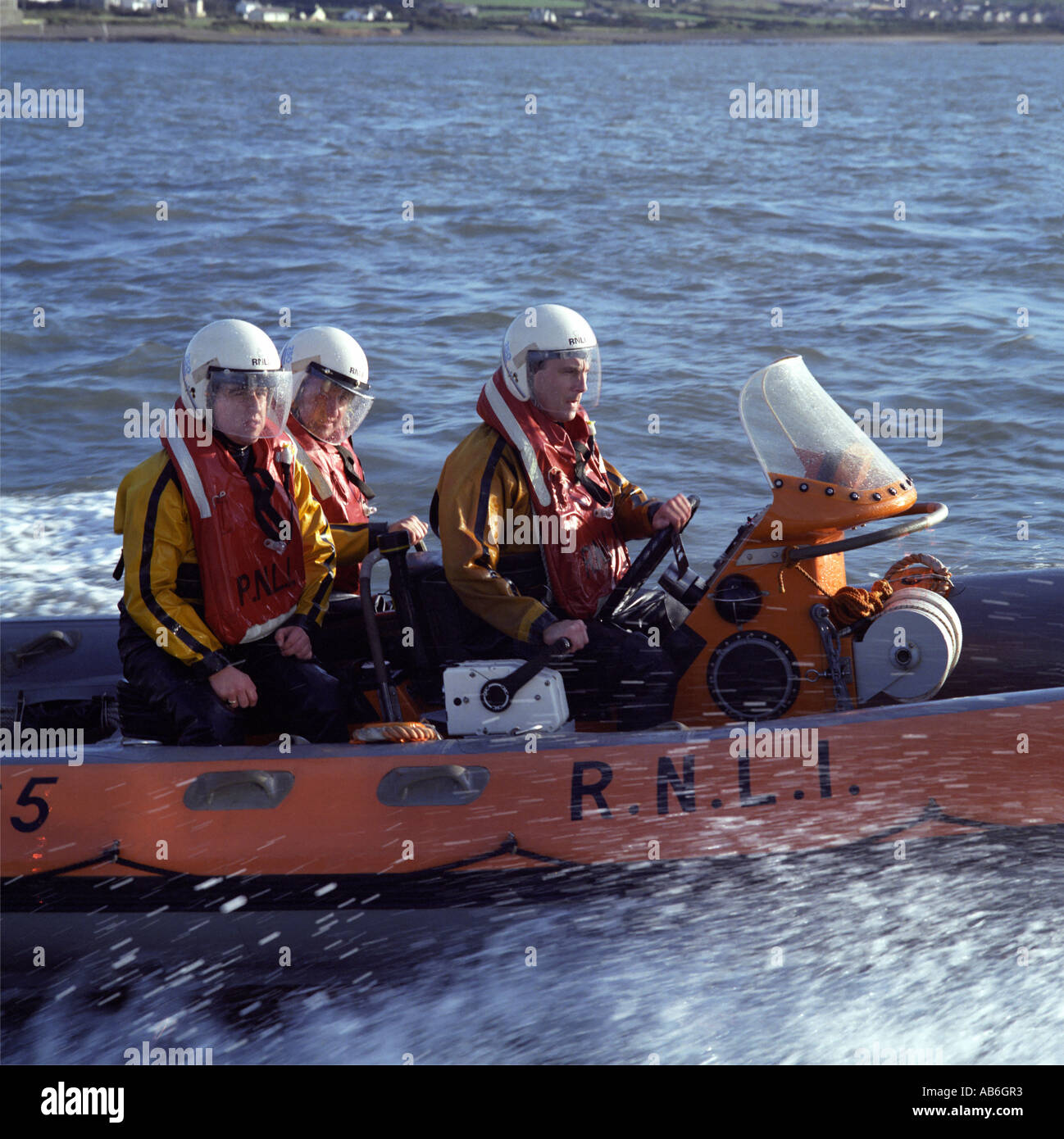 RNLI inshore inflatable lifeboat with 3 crew off Devon coast, UK Stock ...