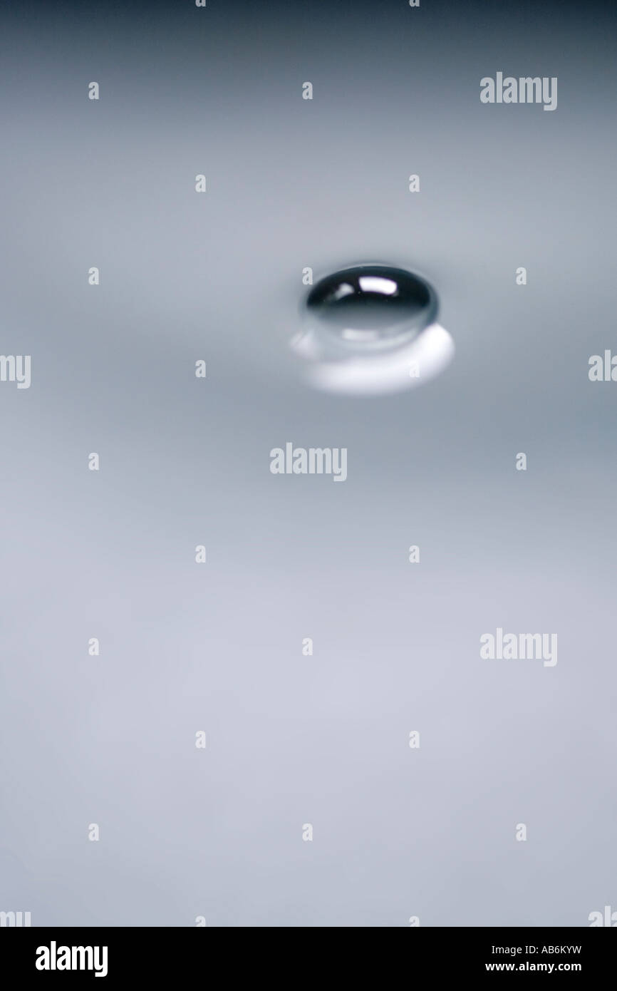Water droplet floating on water Stock Photo - Alamy