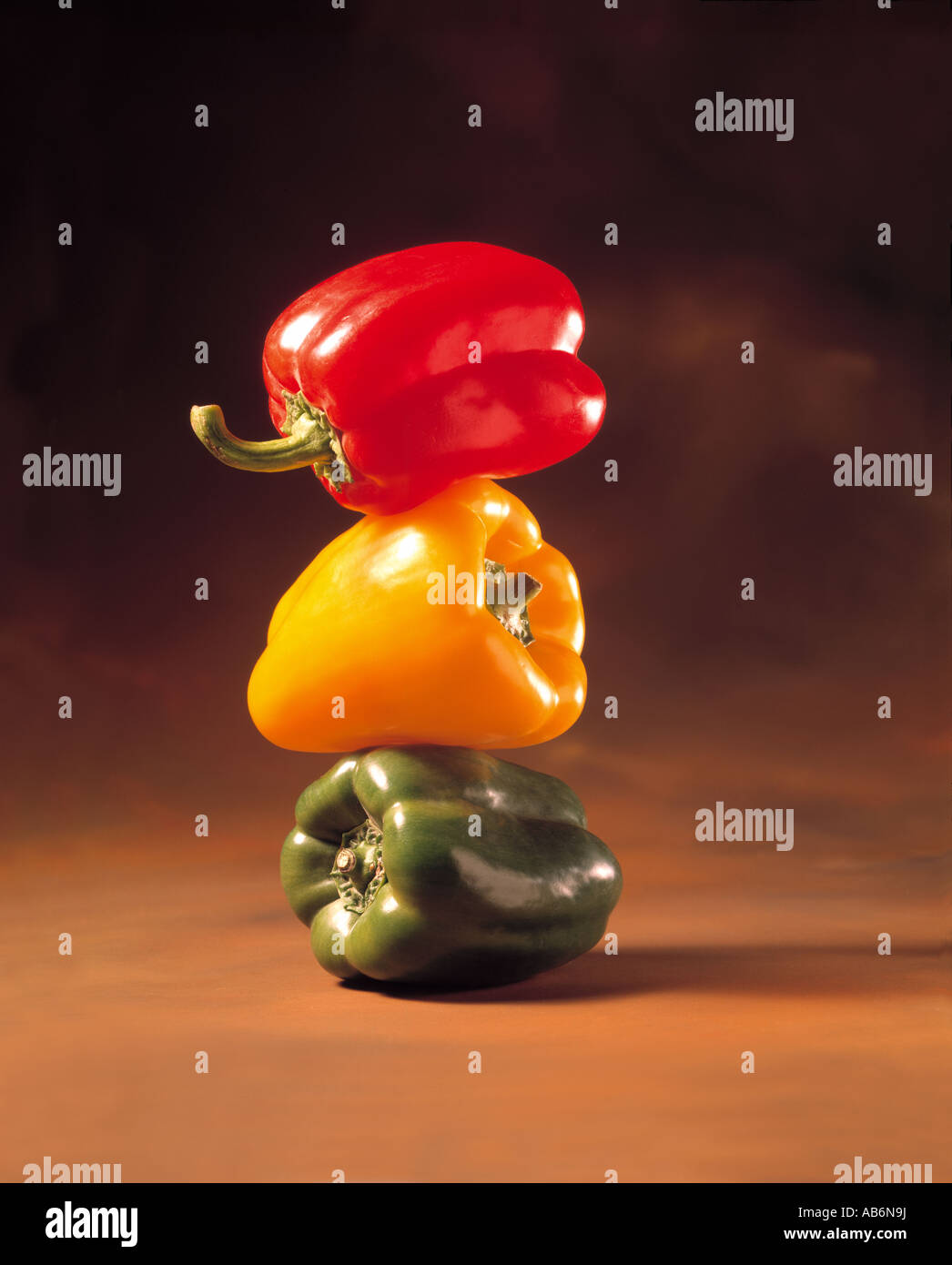 Red, yellow and green sweet peppers in traffic light configuration on ...