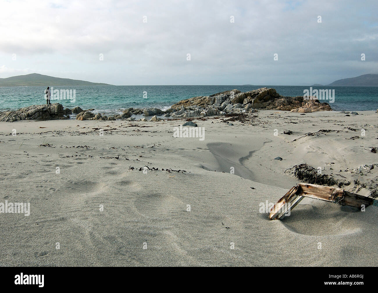 A solitary figure on a sandy beach, Berneray, Scotland Stock Photo - Alamy