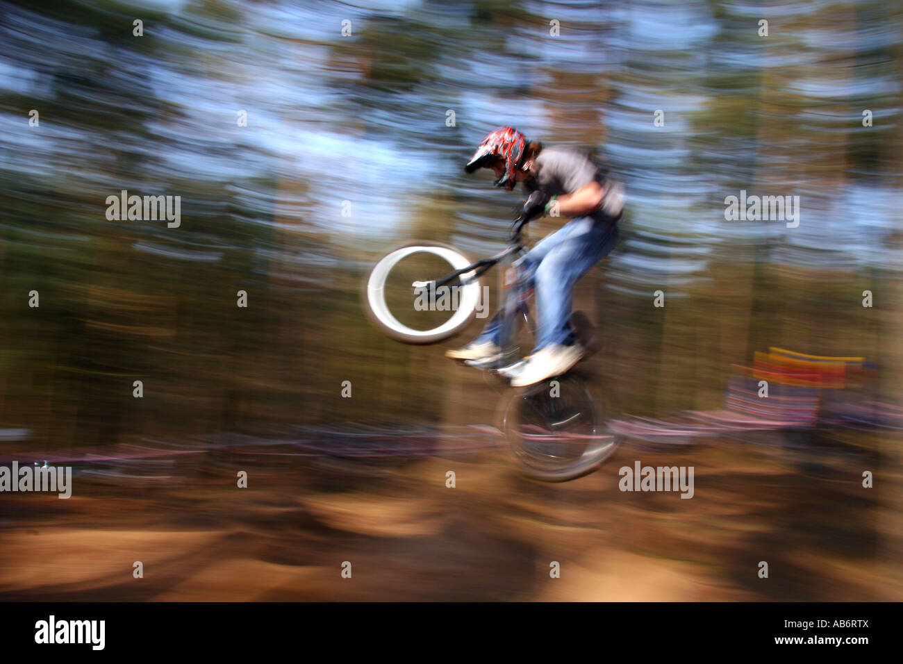 A rider clears a jump at the NPS 4X championship round at Chicksands ...