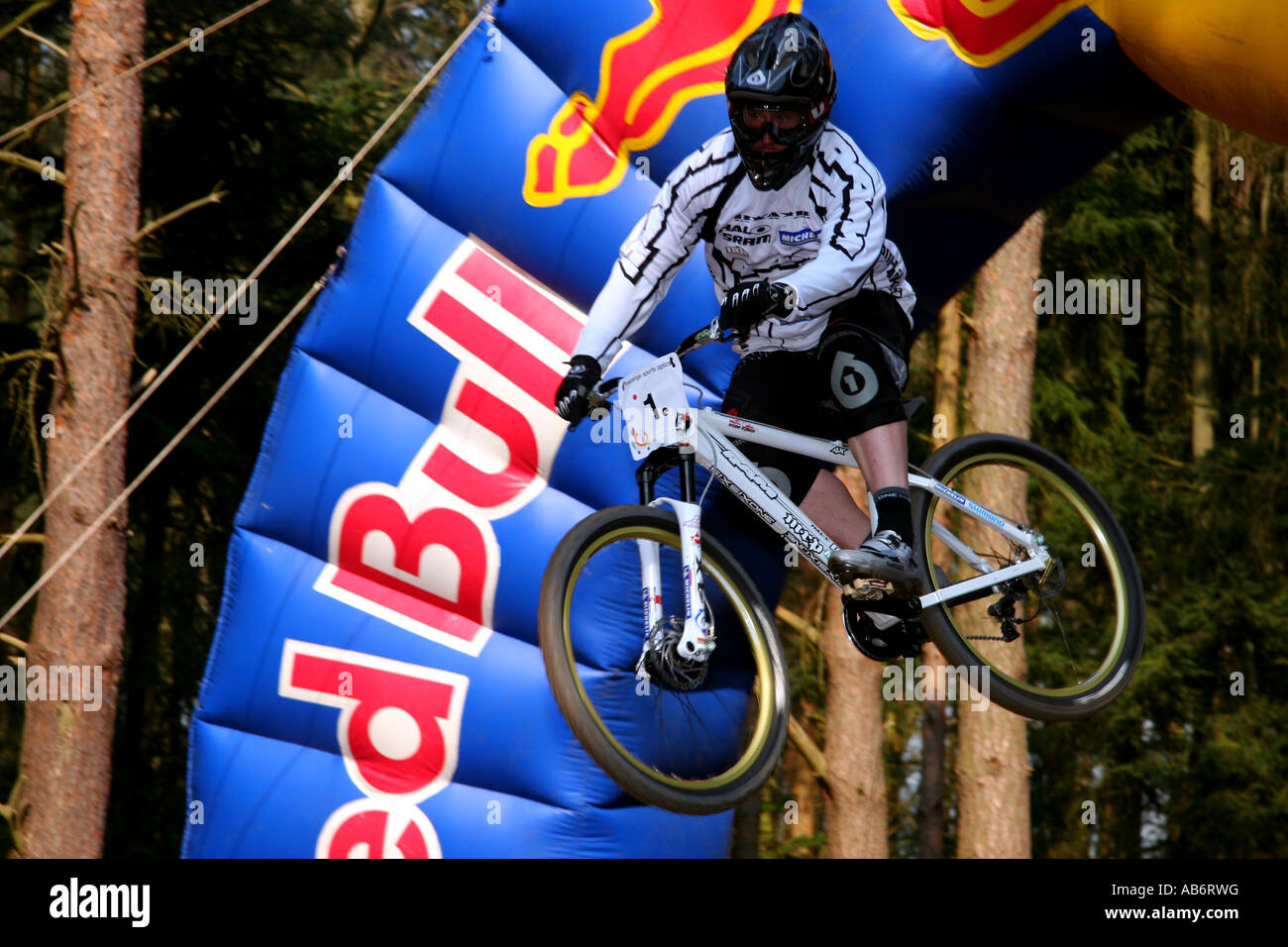 A rider clears a jump at the NPS 4X championship round at Chicksands ...
