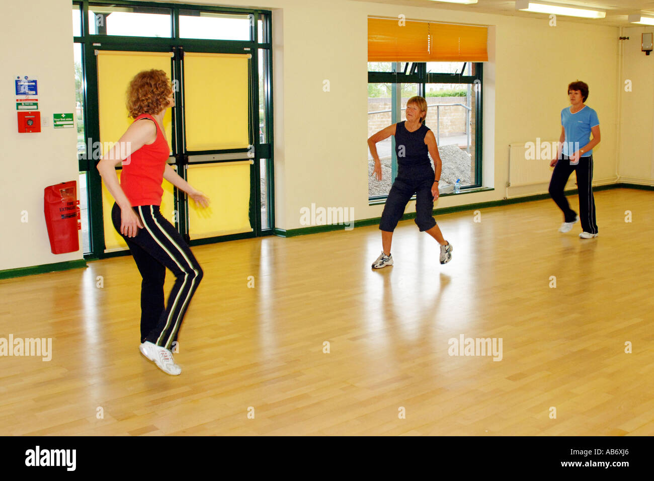 Females doing step exercises in a workout class Stock Photo - Alamy