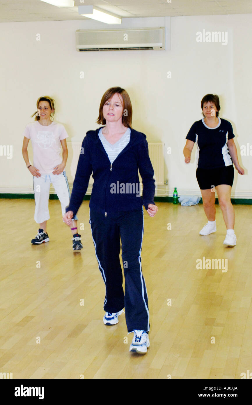 Females doing step exercises in a workout class Stock Photo - Alamy