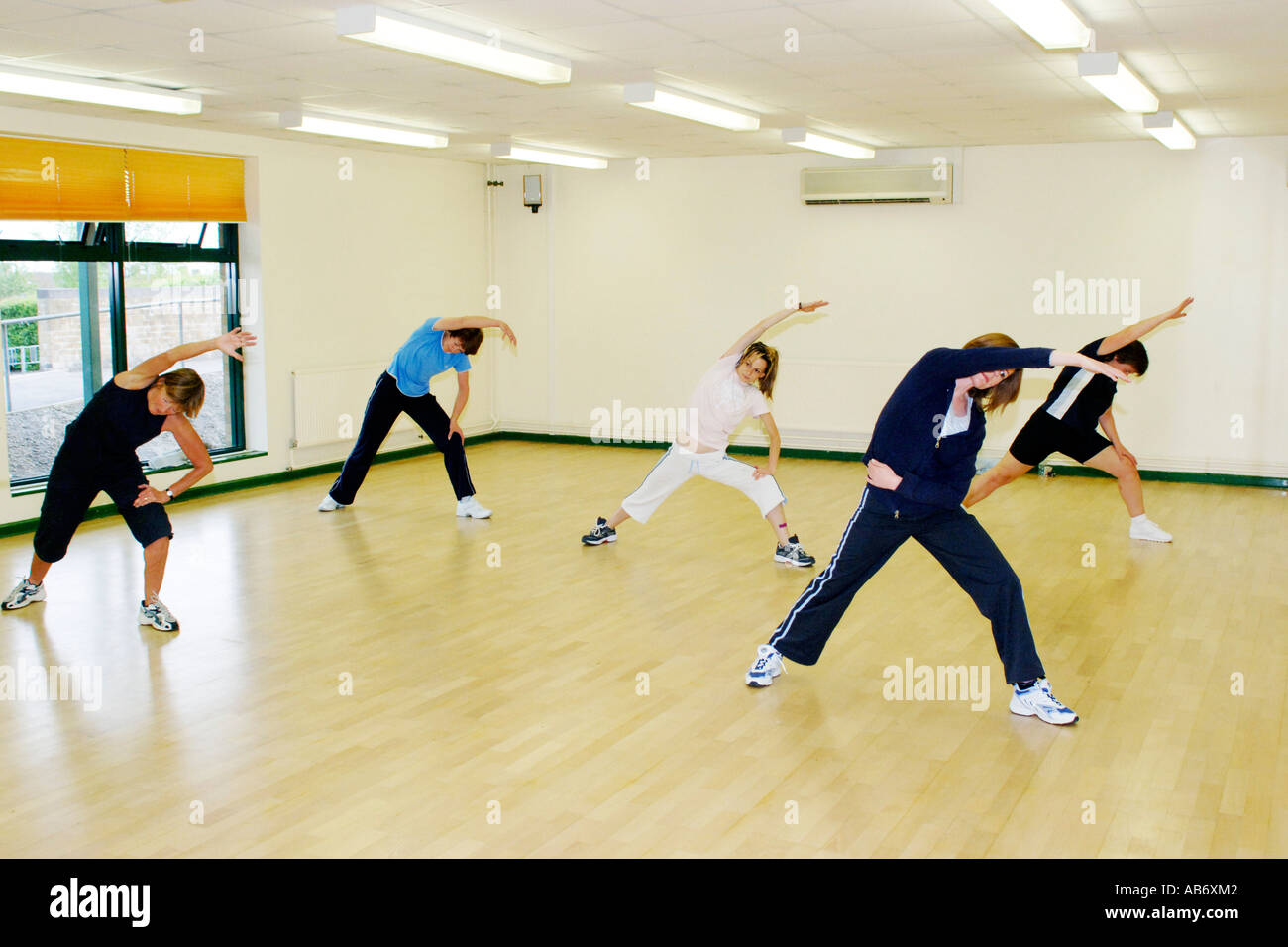 Females doing stretching exercises in a workout class Stock Photo - Alamy