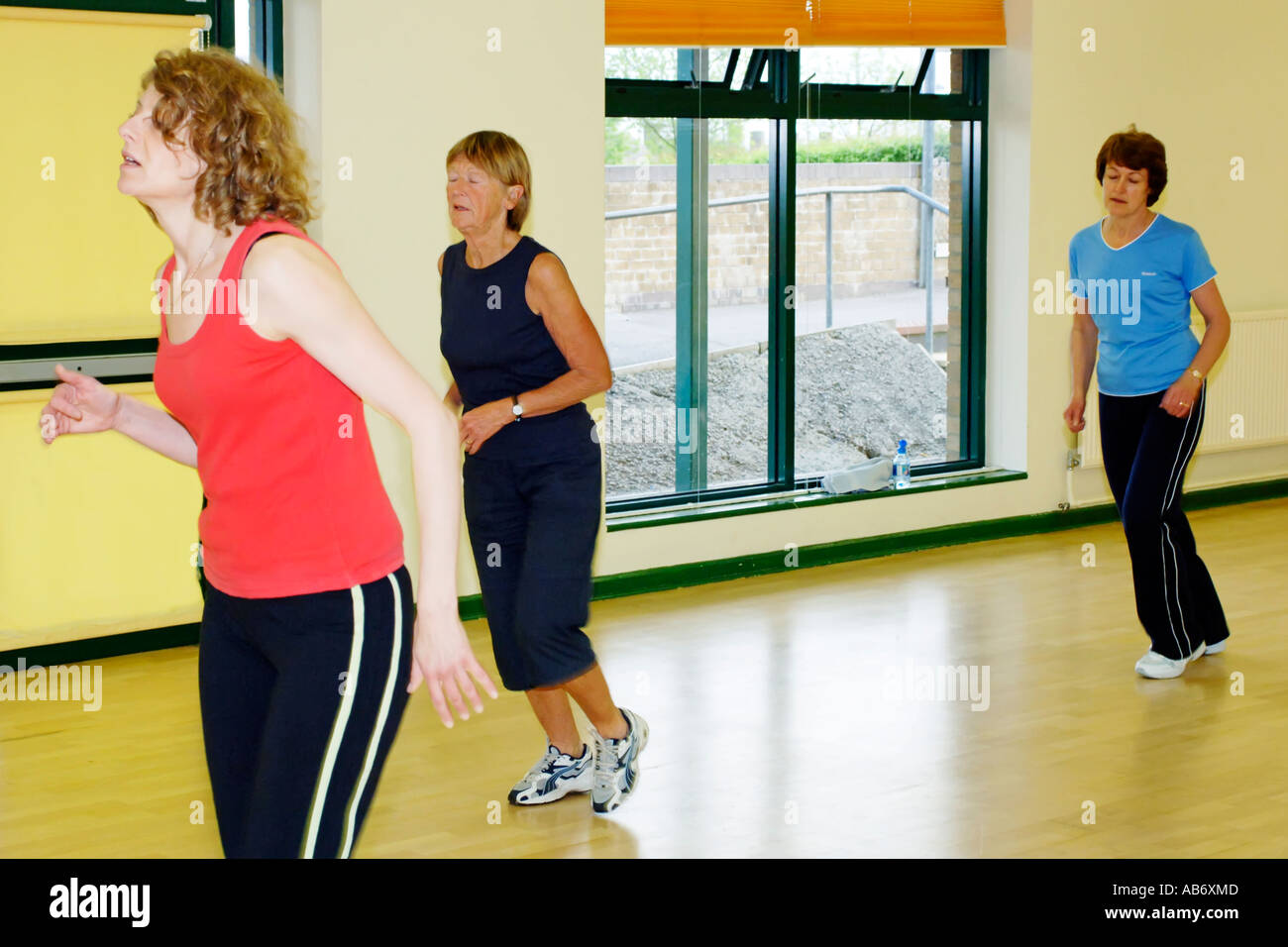 Females doing step exercises in a workout class Stock Photo - Alamy