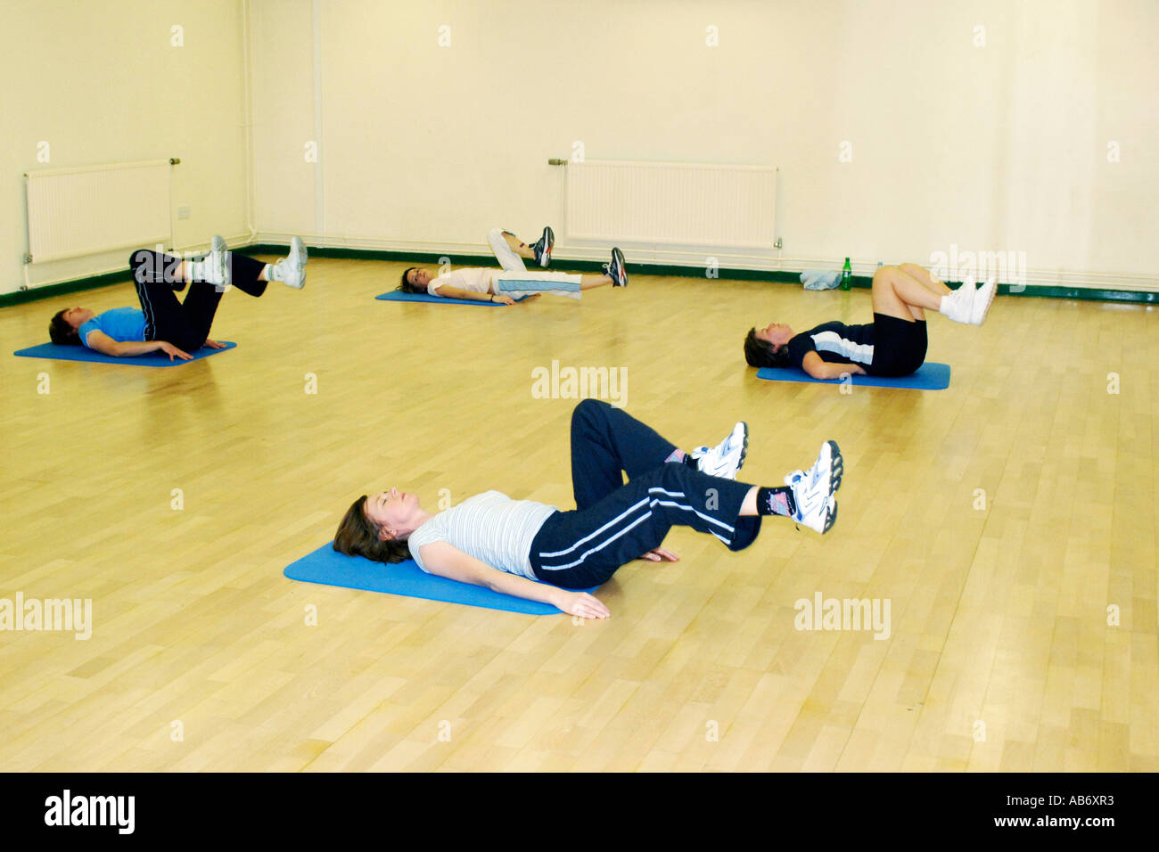 Females doing bicycle exercises to strengthen their leg muscles Stock ...