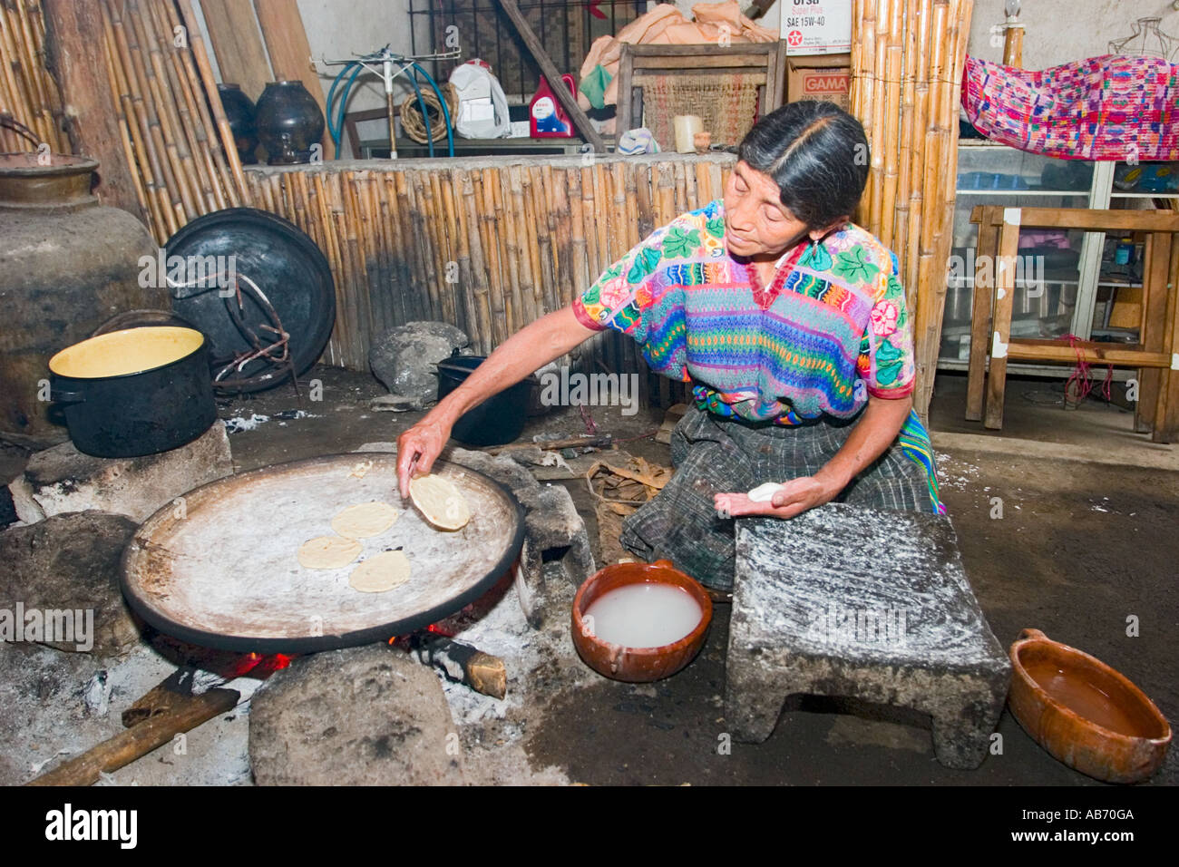 Mayan woman makes tortillas in traditional way Stock Photo - Alamy