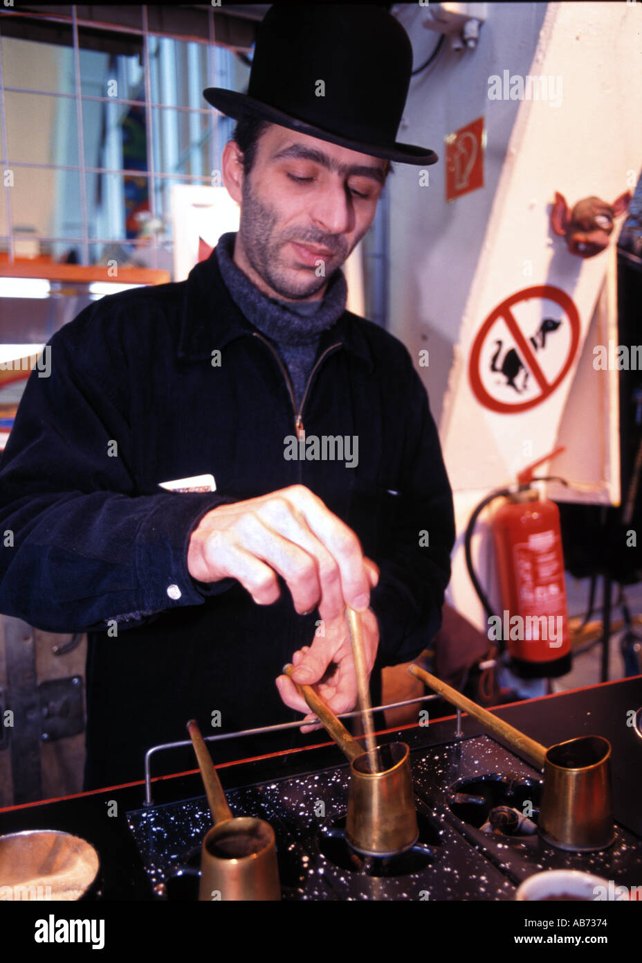A turkish man served handmade turkish coffee in front of customer Stock ...