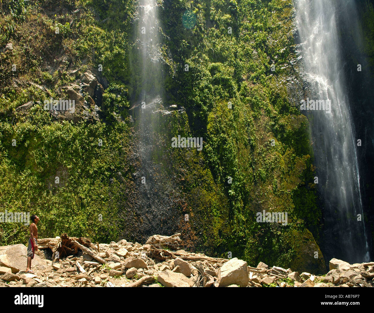 Man observing San Ramon waterfall, Maderas Volcano, Ometepe Island ...