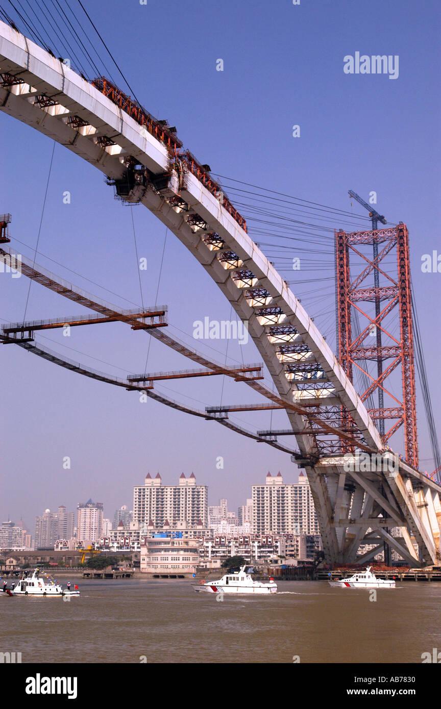 The steel arch of Lupu Bridge under construction in Shanghai China 2002 ...