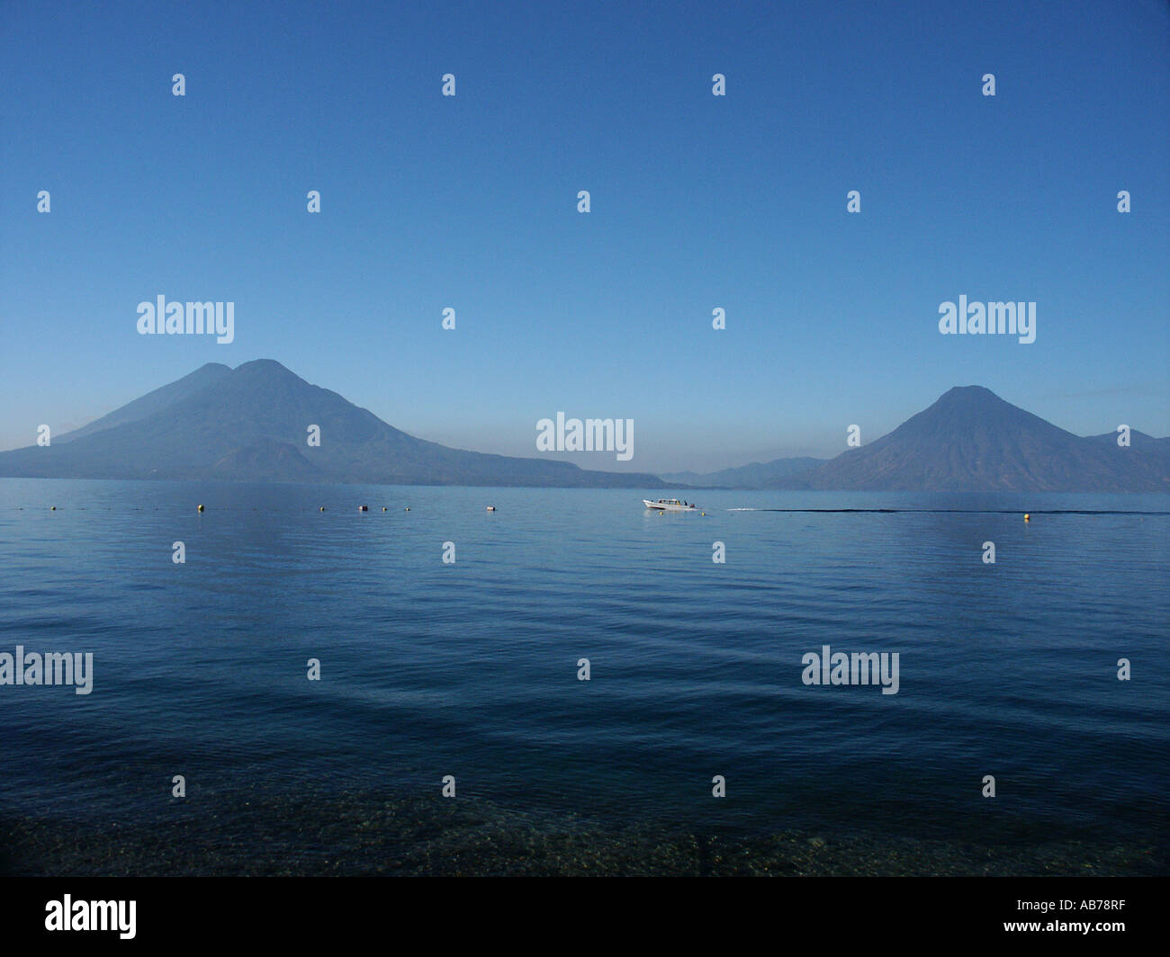 Lake Atitlan with San Pedro and Toliman Volcanoes as seen from the port ...