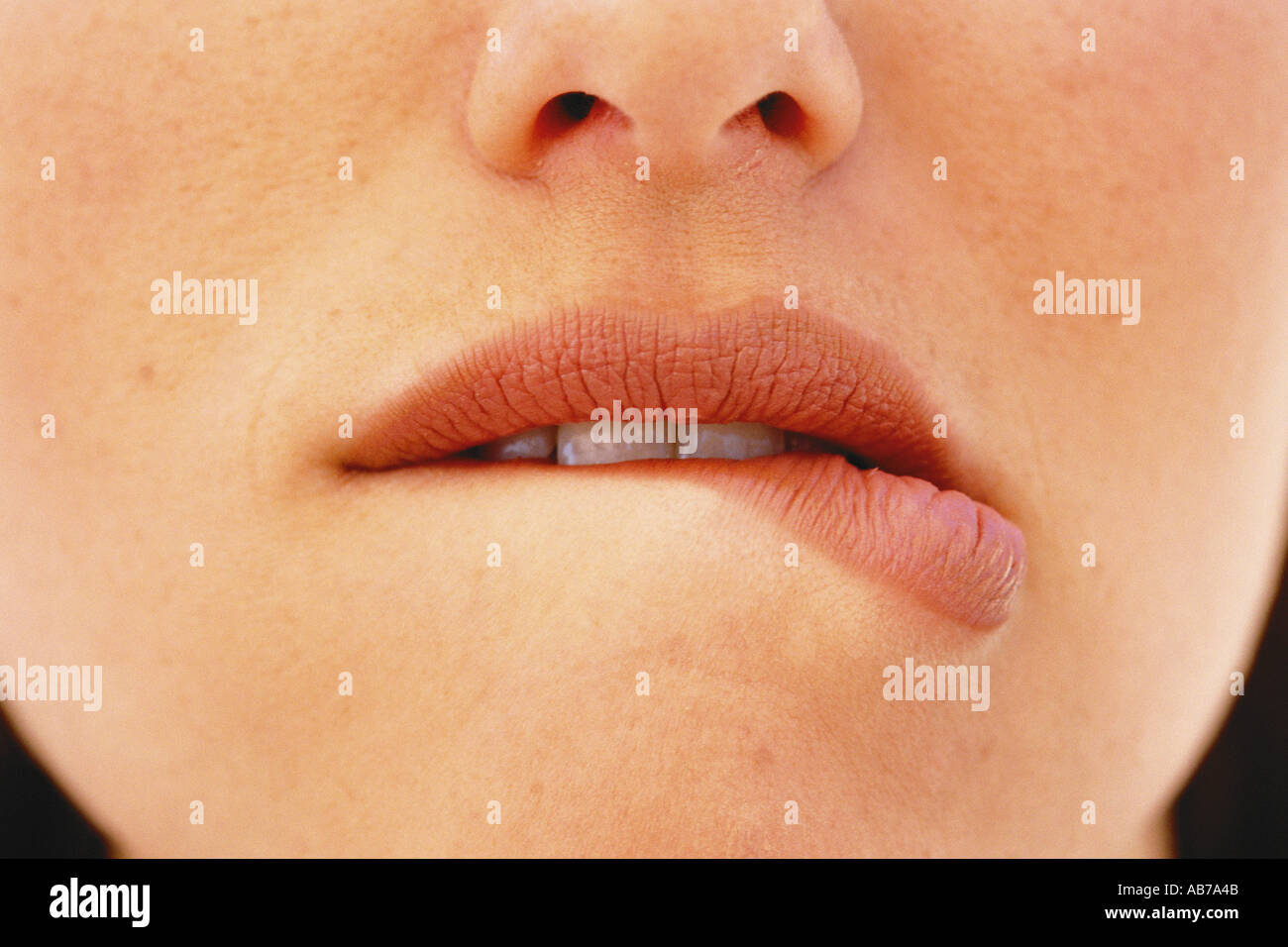 Bitten lips hi-res stock photography and images - Alamy