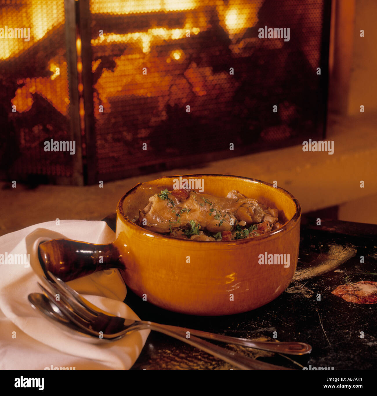 Rabbit casserole by the fire Stock Photo - Alamy