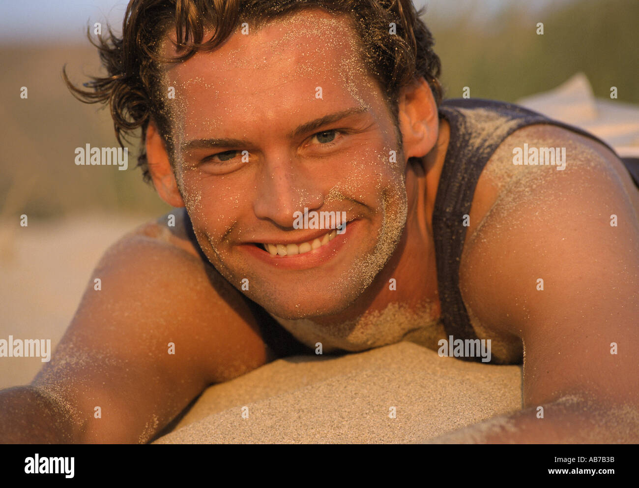 Man lying on beach cropped hi-res stock photography and images - Alamy