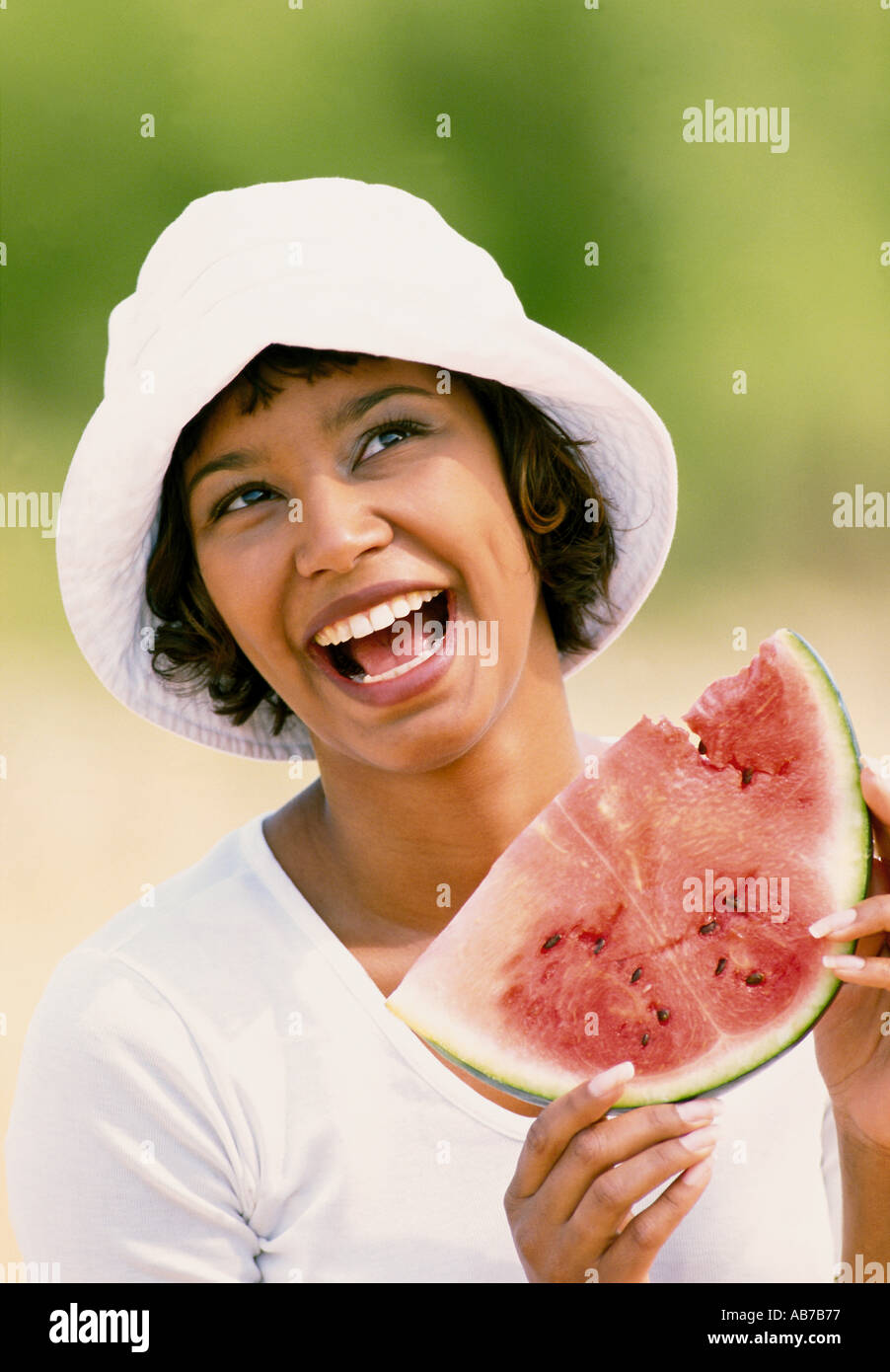 Woman with melon Stock Photo - Alamy