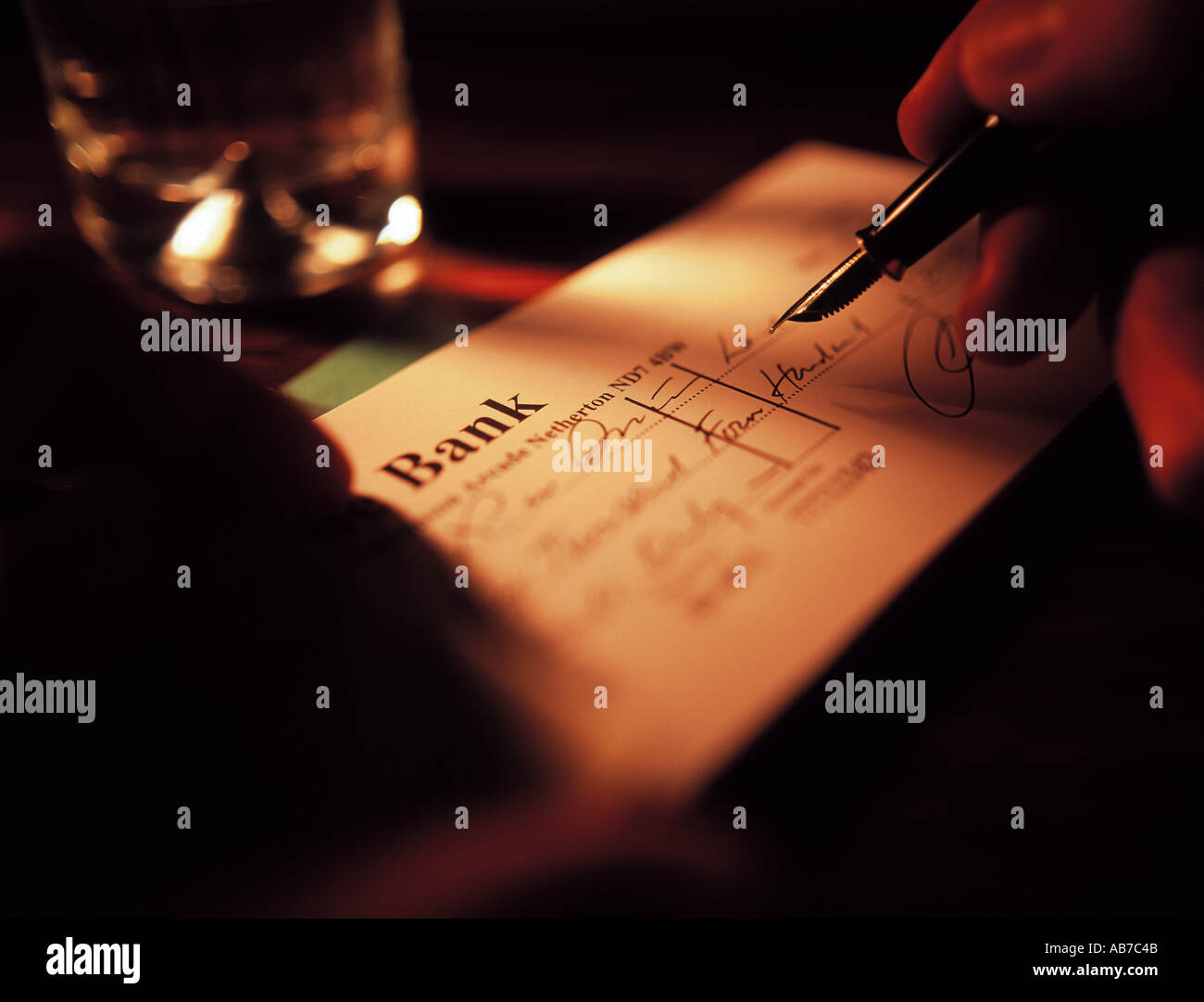 Hand writing cheque hi-res stock photography and images - Alamy