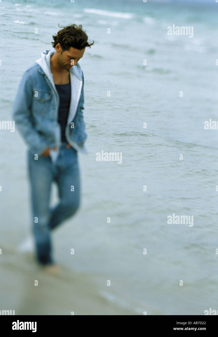 Man on beach Stock Photo - Alamy
