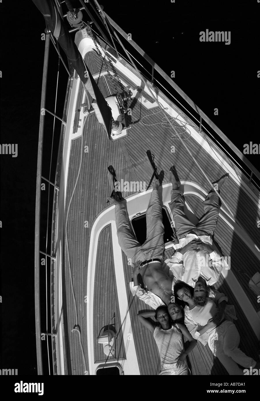 Man on sailboat sailing Black and White Stock Photos & Images - Alamy