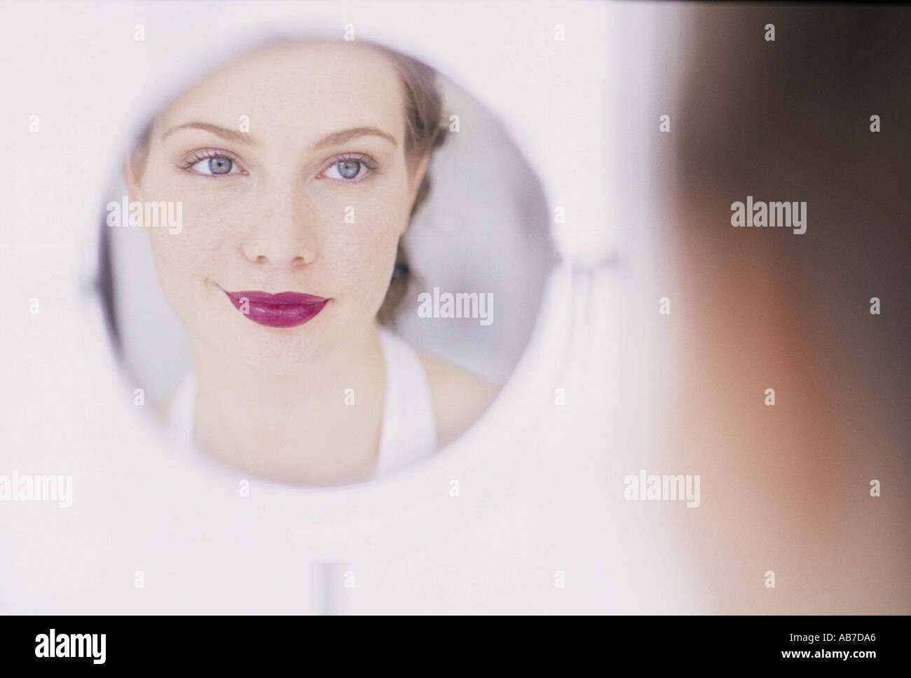 Woman in mirror Stock Photo - Alamy