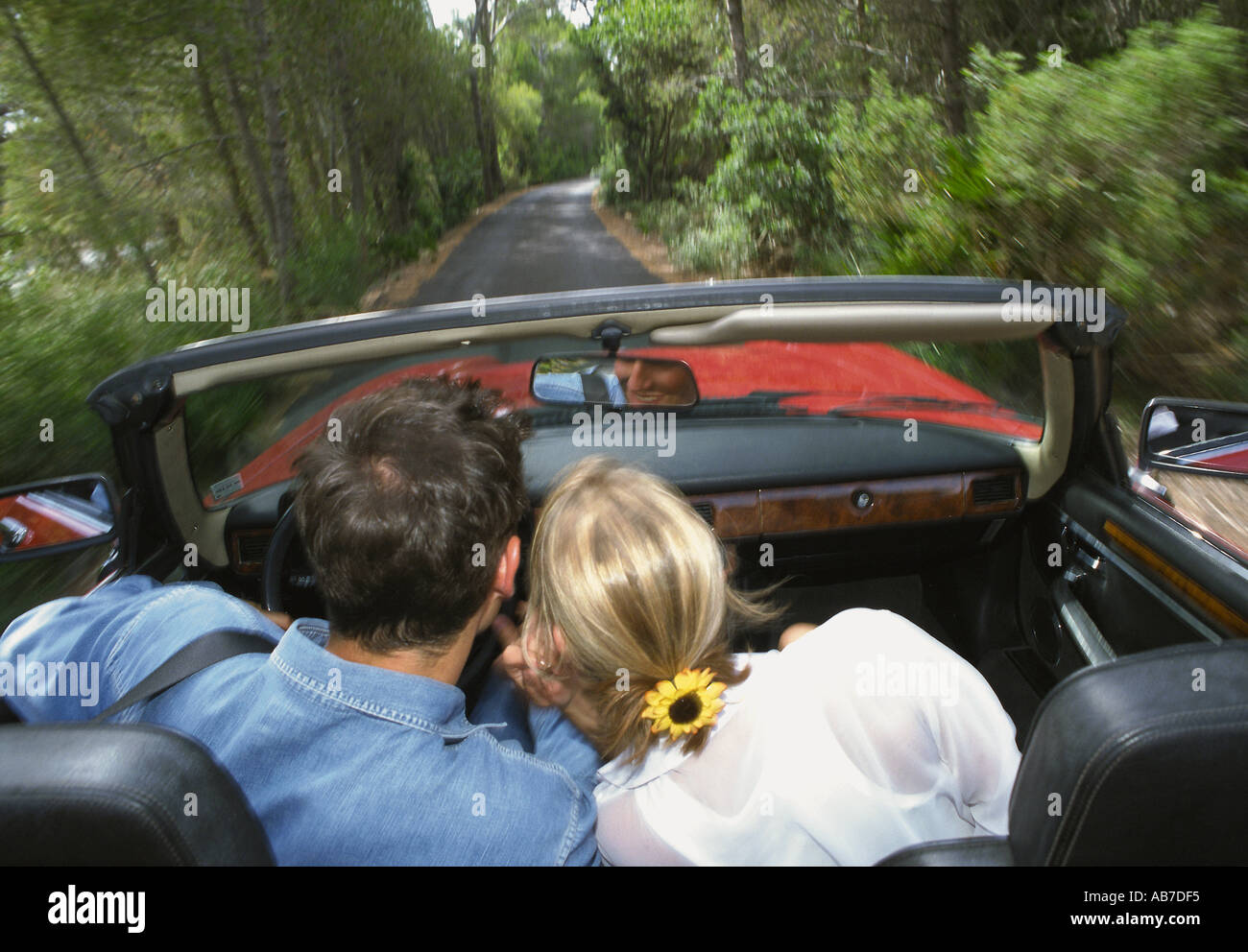 Couple in convertible Stock Photo - Alamy