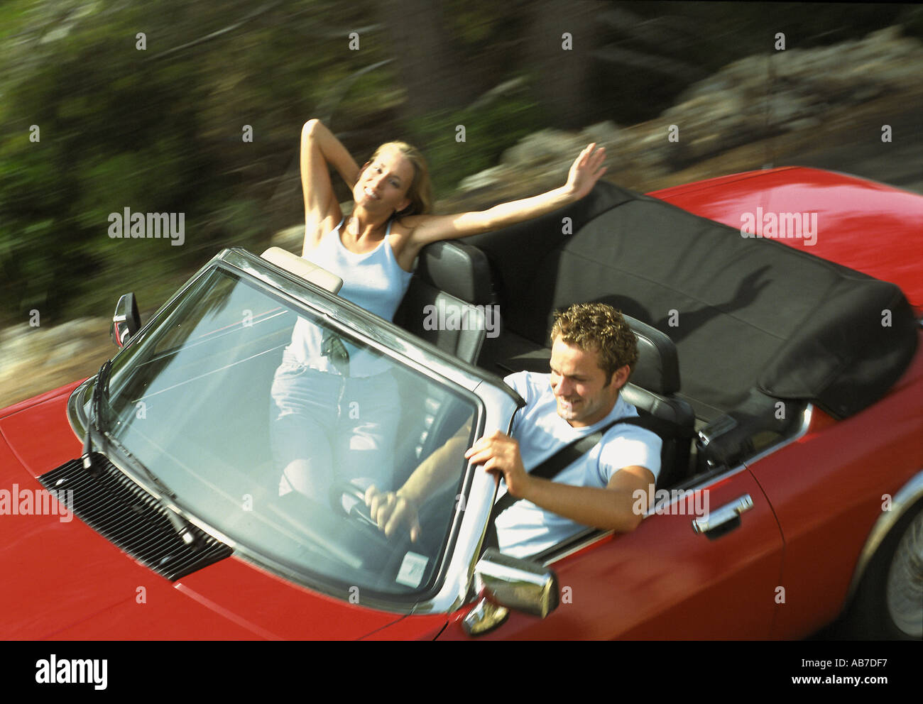 Couple in convertible Stock Photo - Alamy