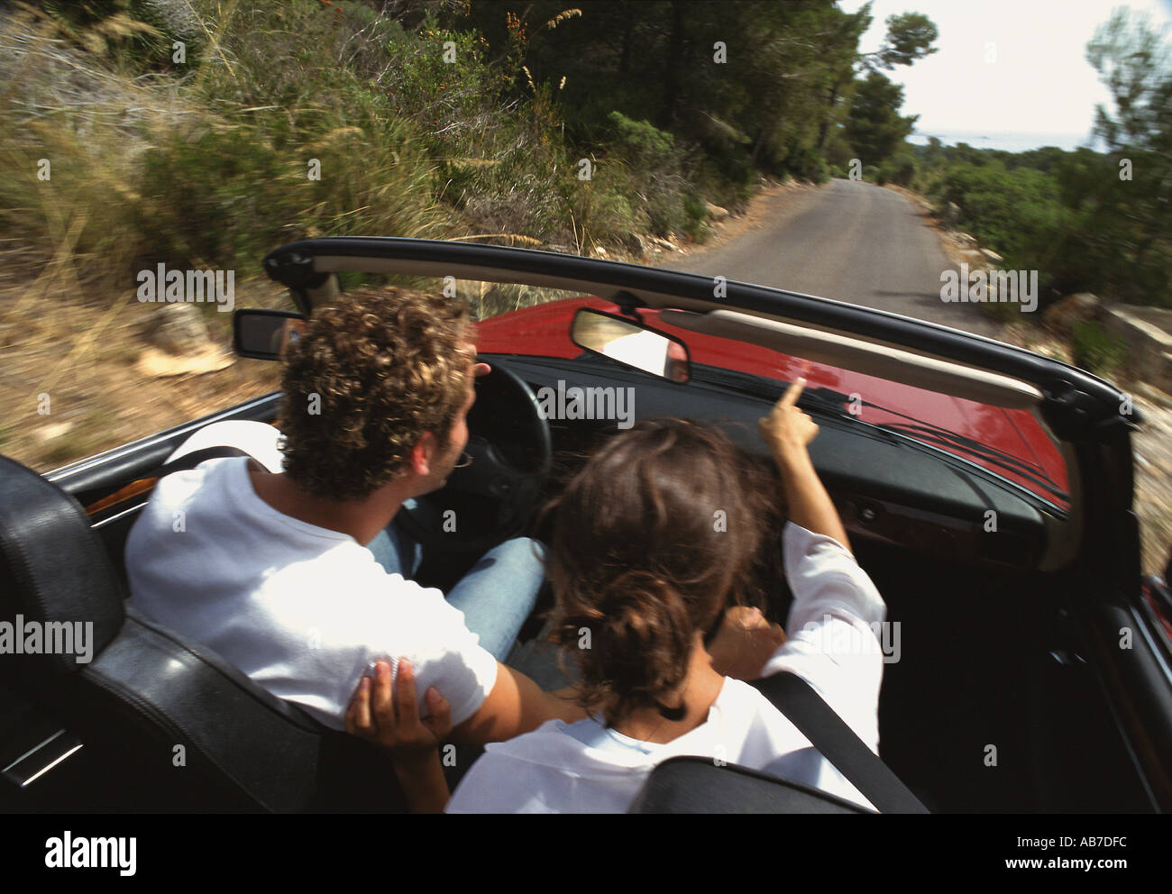 Couple in convertible Stock Photo - Alamy