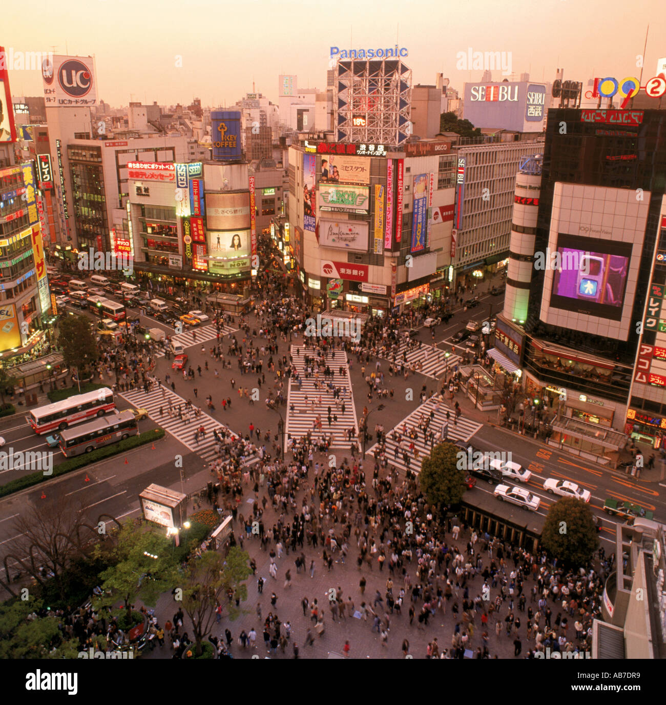 Pedestrians filling crosswalks in Shibuya district of Tokyo under ...