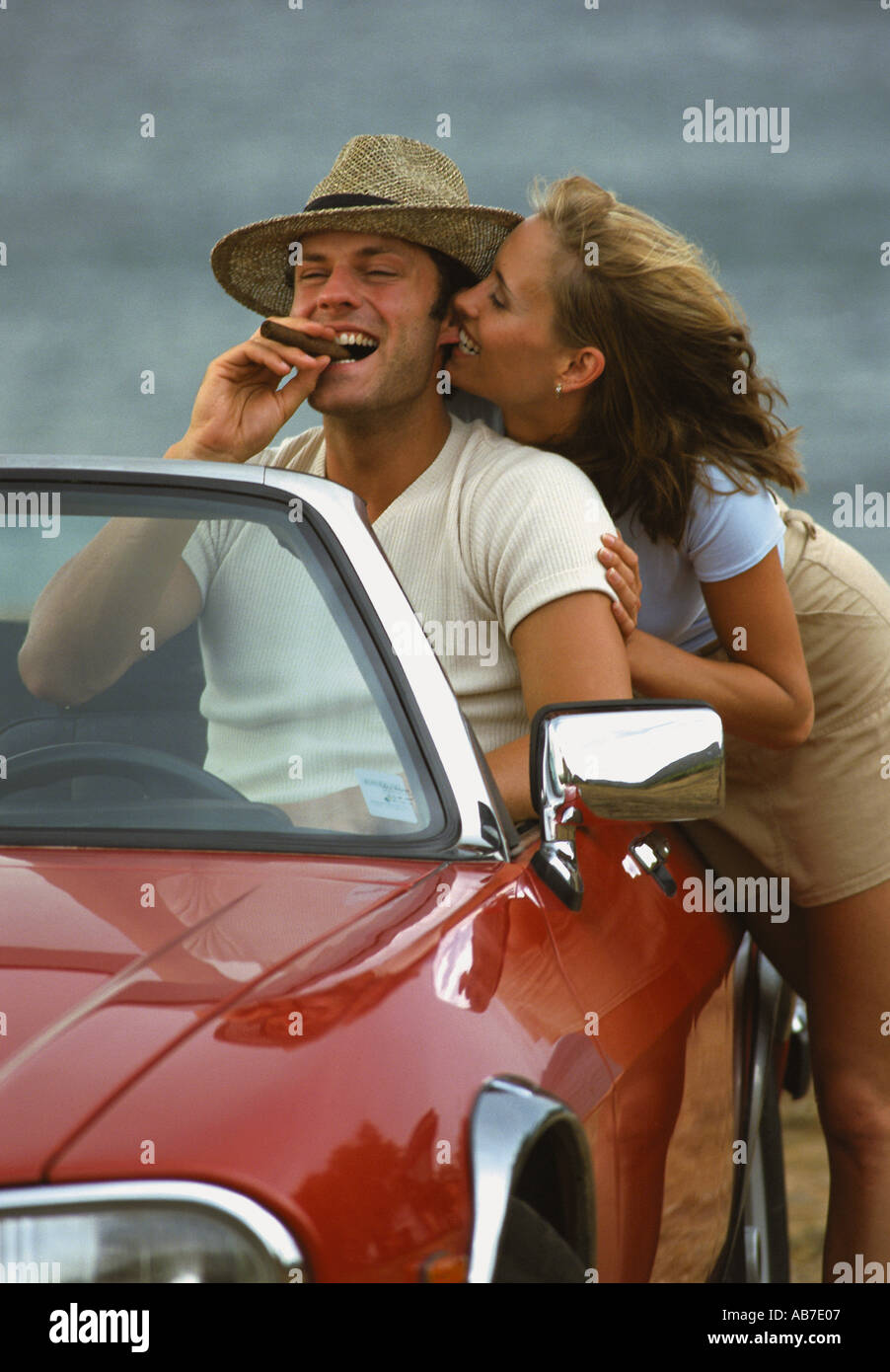 Couple in convertible Stock Photo - Alamy
