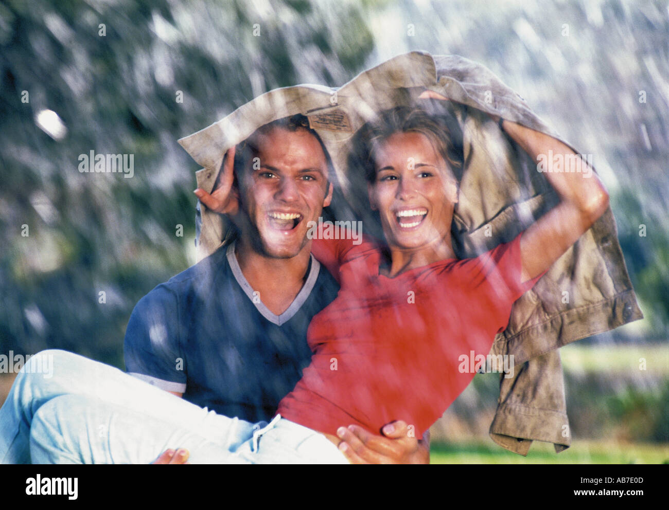 Couple in the rain Stock Photo - Alamy