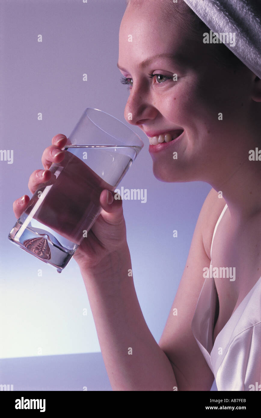 Woman drinking water Stock Photo - Alamy