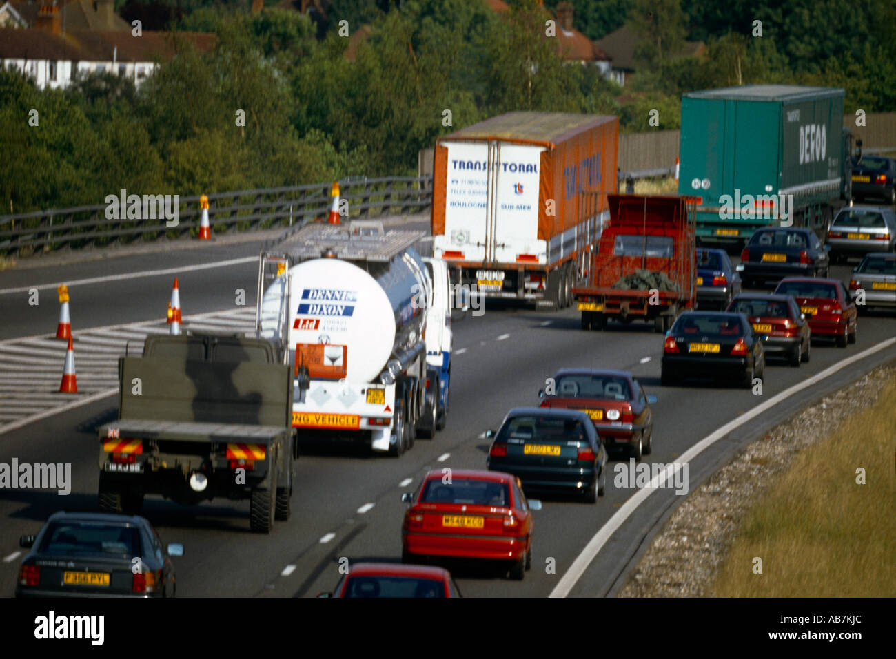 M25 Traffic Jam and Houses near Motorway Stock Photo - Alamy