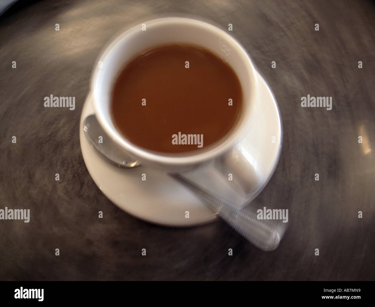 Coffee swirling cup Stock Photo - Alamy