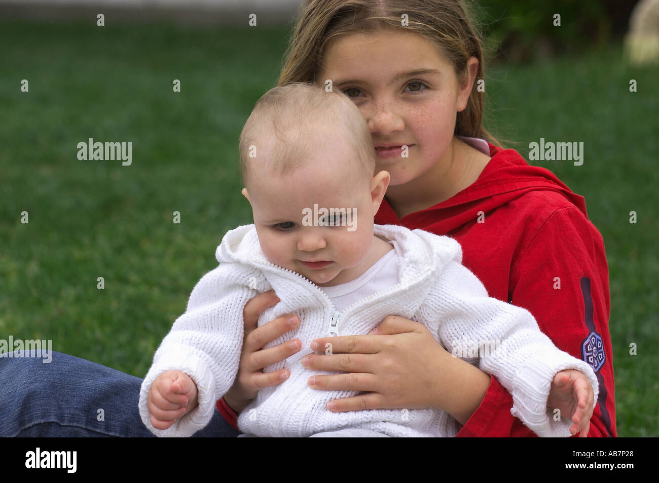 Baby girl smiles looking up hi-res stock photography and images - Alamy