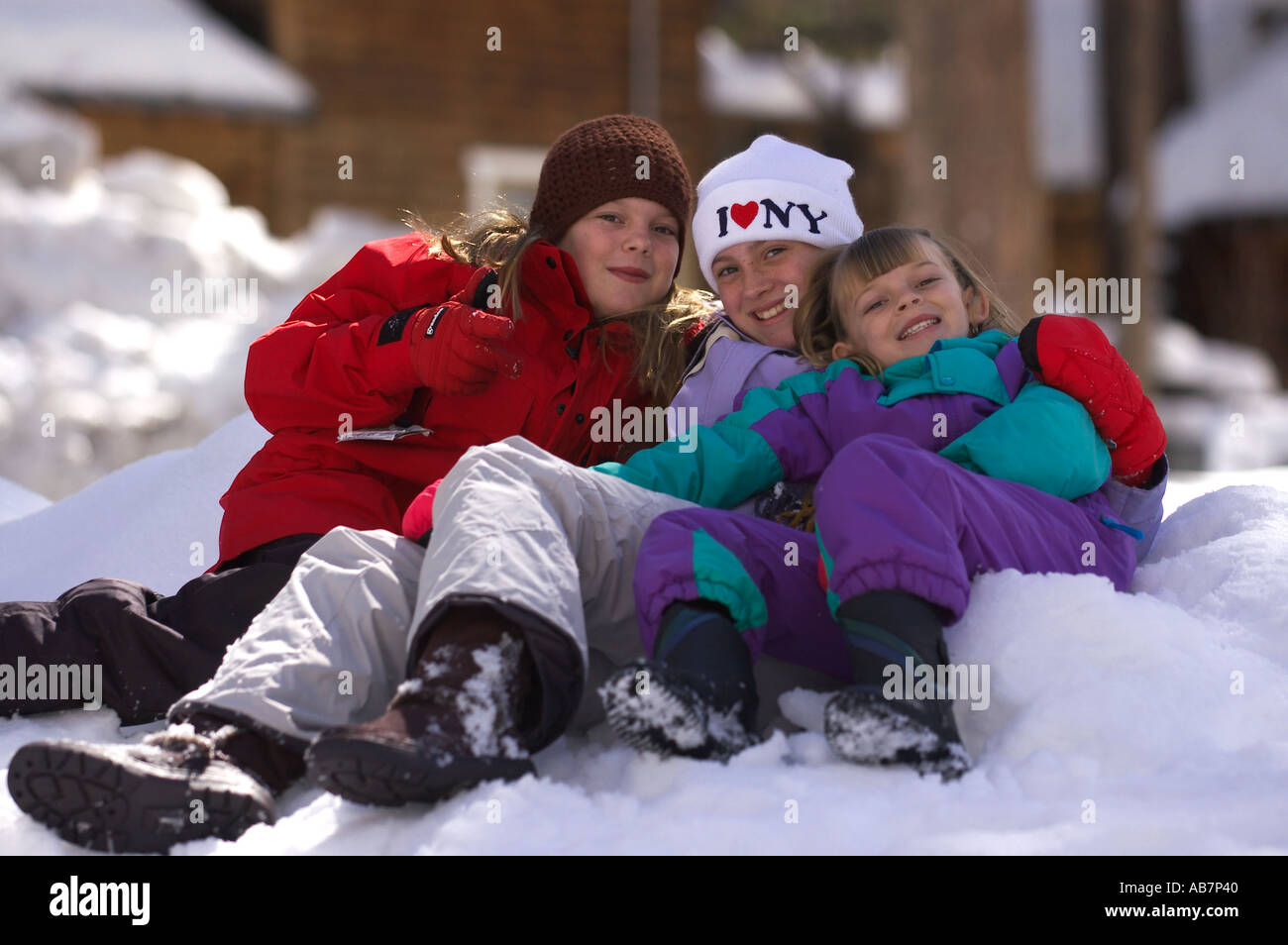 three girls in the snow Stock Photo - Alamy