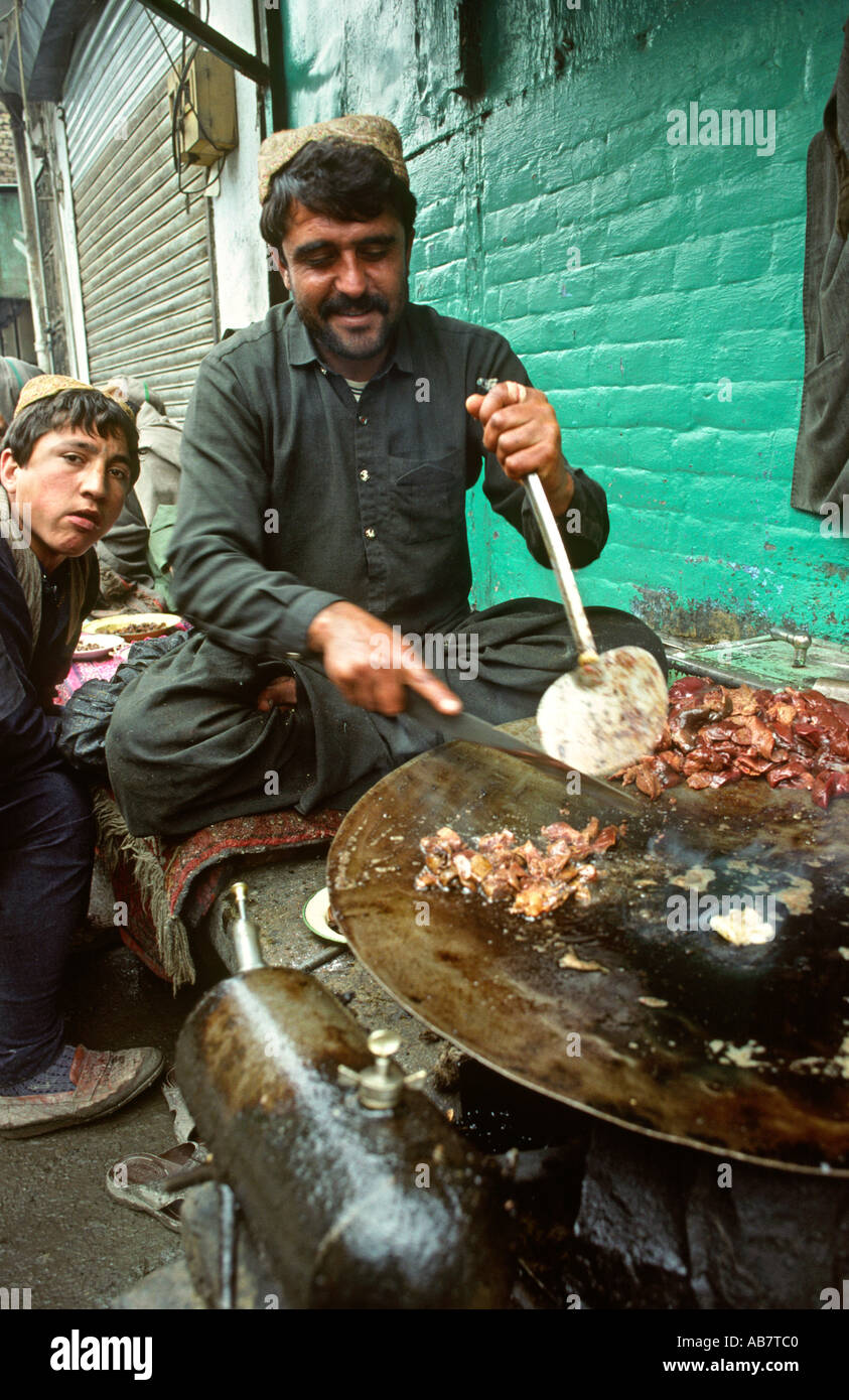 Pakistan Baluchistan Quetta man cooking liver on a karahi Stock Photo ...