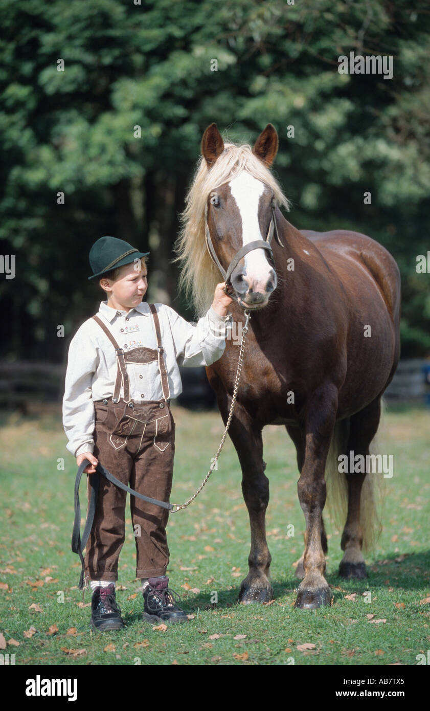 domestic horse (Equus przewalskii f. caballus), boy in traditional ...