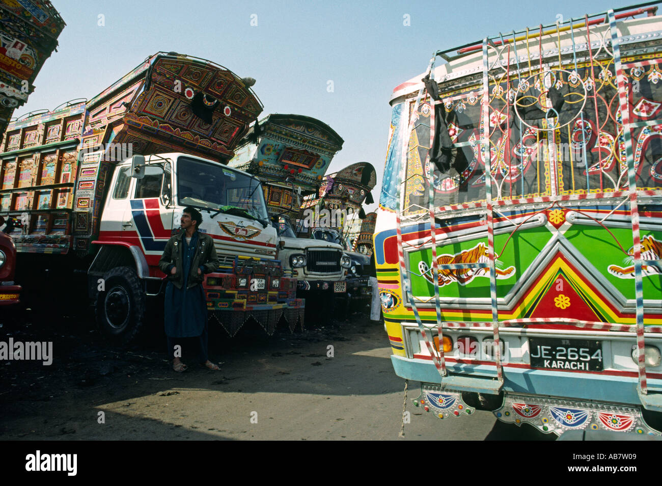 Pakistan Transport Sind Karachi man with decorated trucks awaiting ...