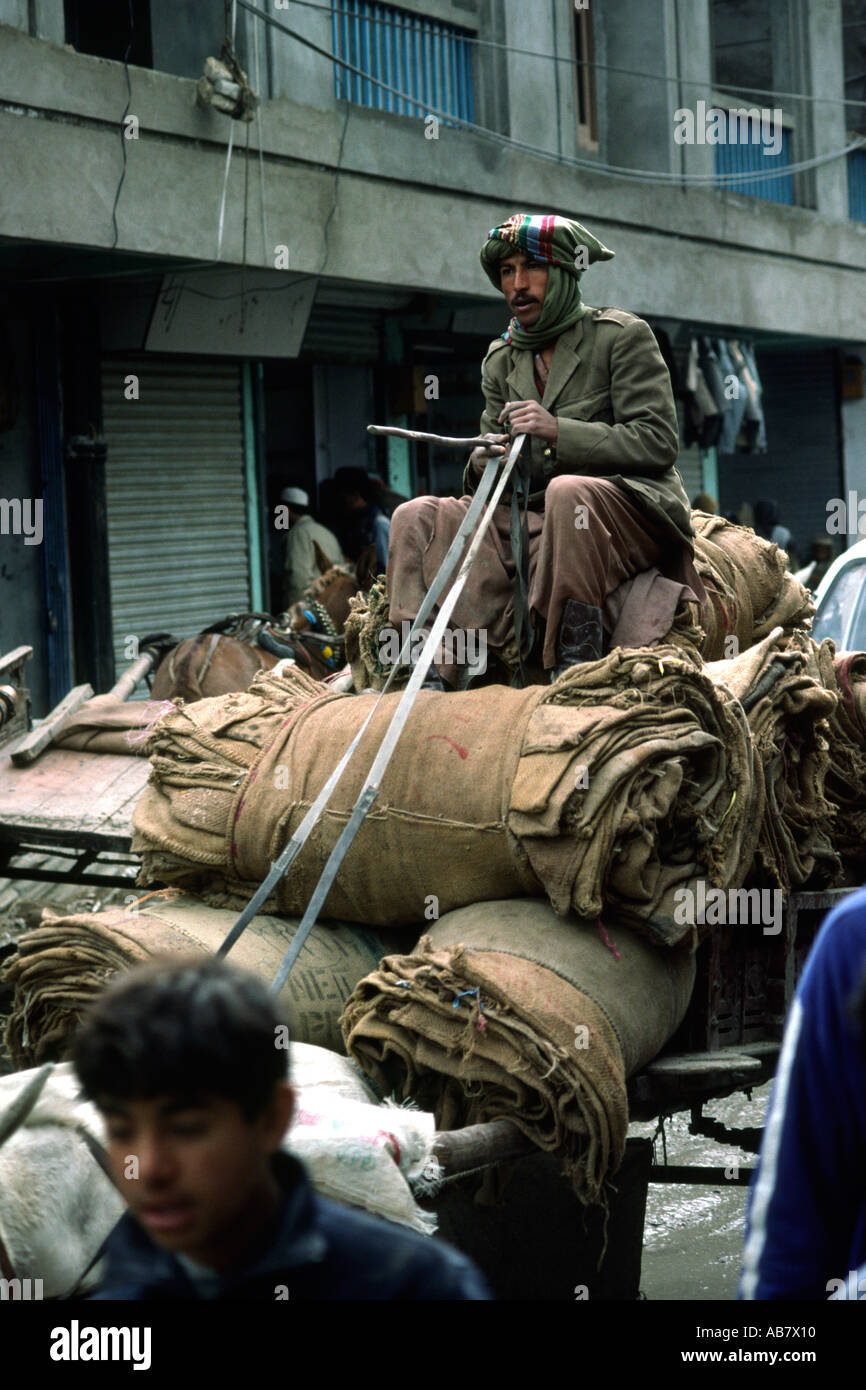 Pakistan Baluchistan Quetta man driving laden donkey cart Stock Photo ...