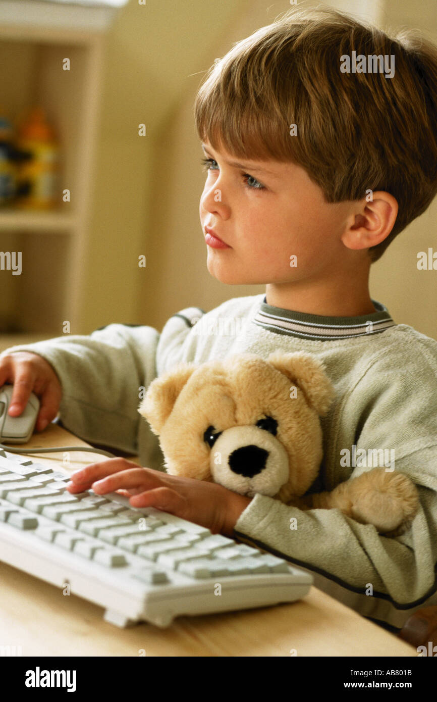 Boy at computer Stock Photo - Alamy
