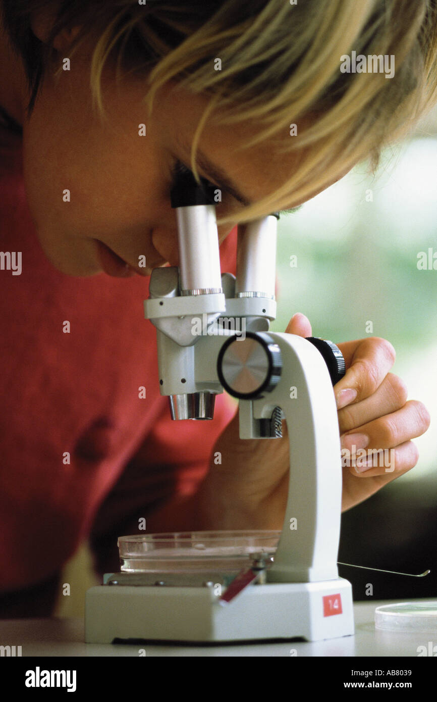 Girl with microscope Stock Photo - Alamy