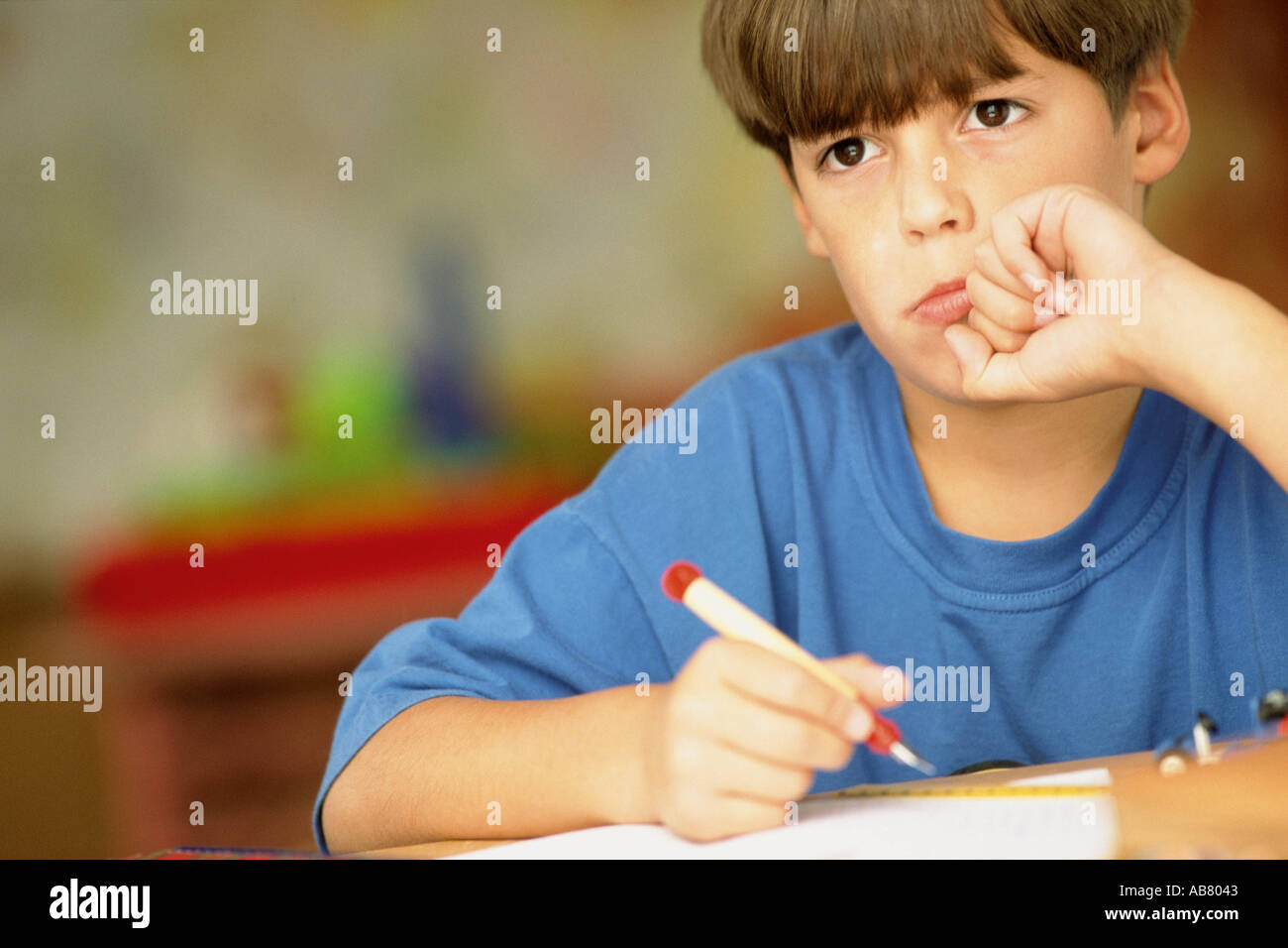 Boy doing homework Stock Photo - Alamy
