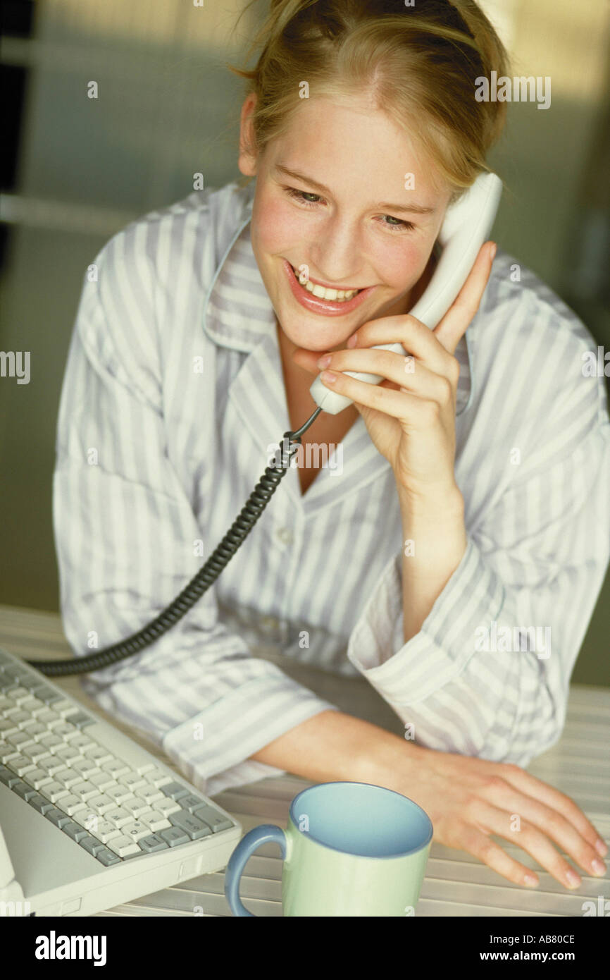 Girl using telephone Stock Photo - Alamy