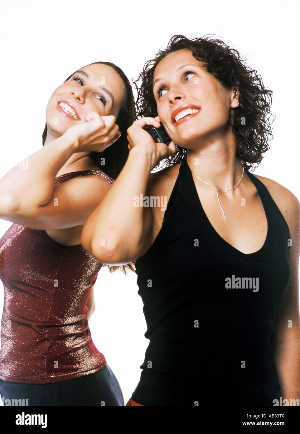 two women using mobile phone Stock Photo - Alamy