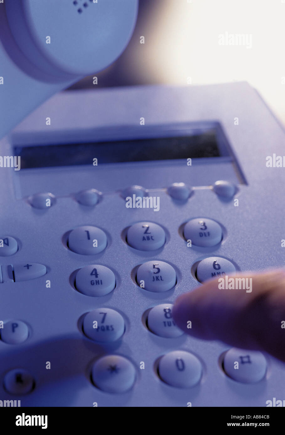 Person dialling a telephone Stock Photo - Alamy