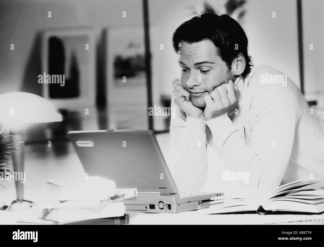 Laptop computer sitting on Black and White Stock Photos & Images - Alamy