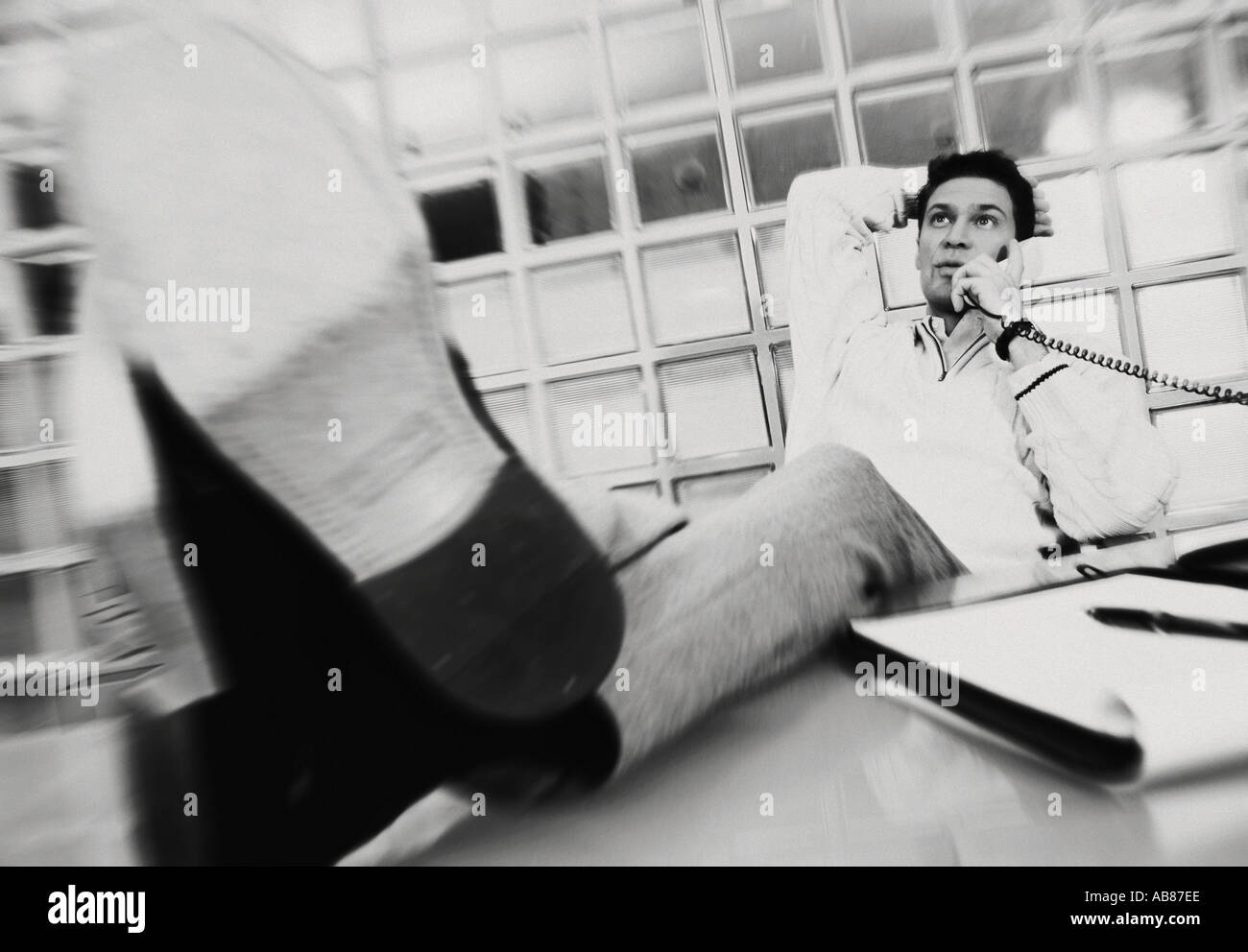 Man telephone office feet desk hi-res stock photography and images - Alamy