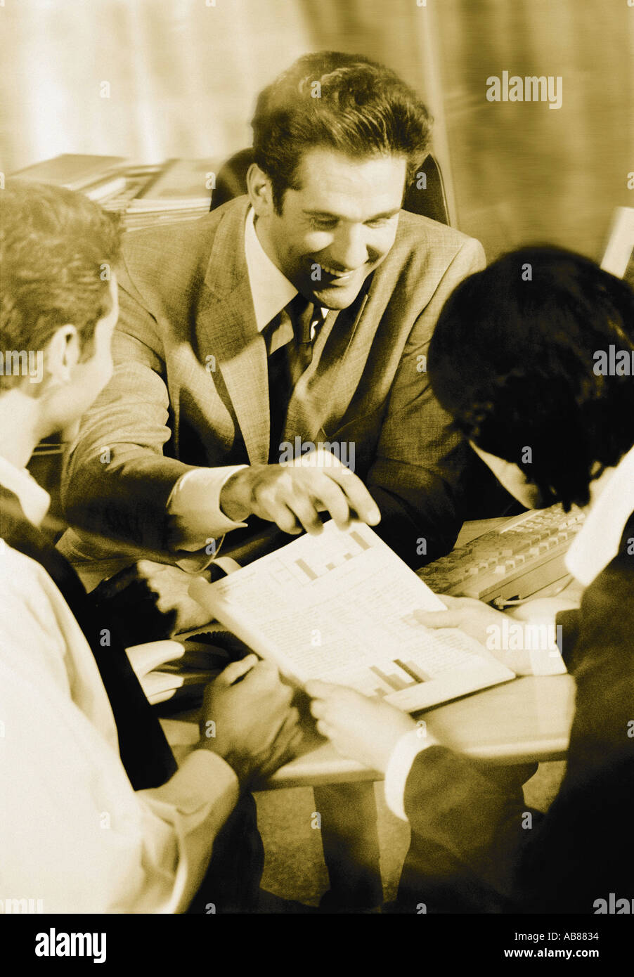 Businesspeople looking at graph Stock Photo - Alamy Businesspeople looking at graph Stock Photo - Alamy