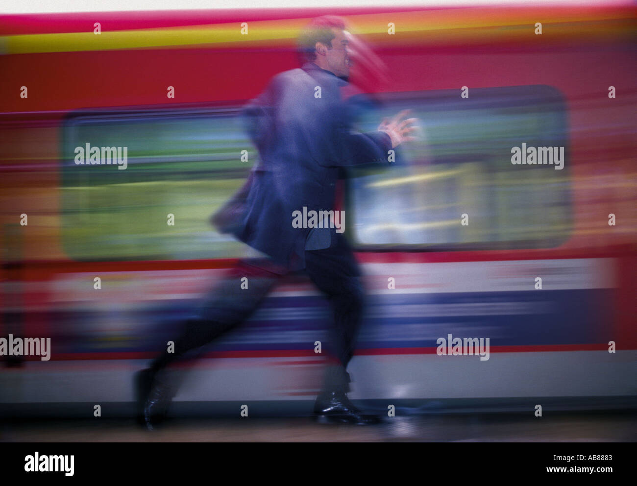 Man running after train Stock Photo - Alamy